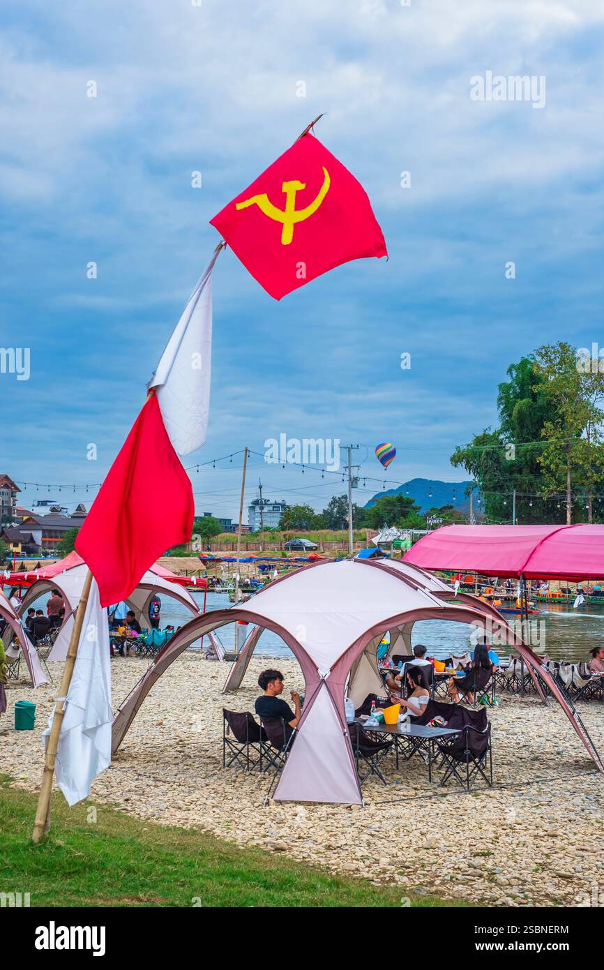 Laos, Vientiane province, Vang Vieng, bars and restaurants set up on ...
