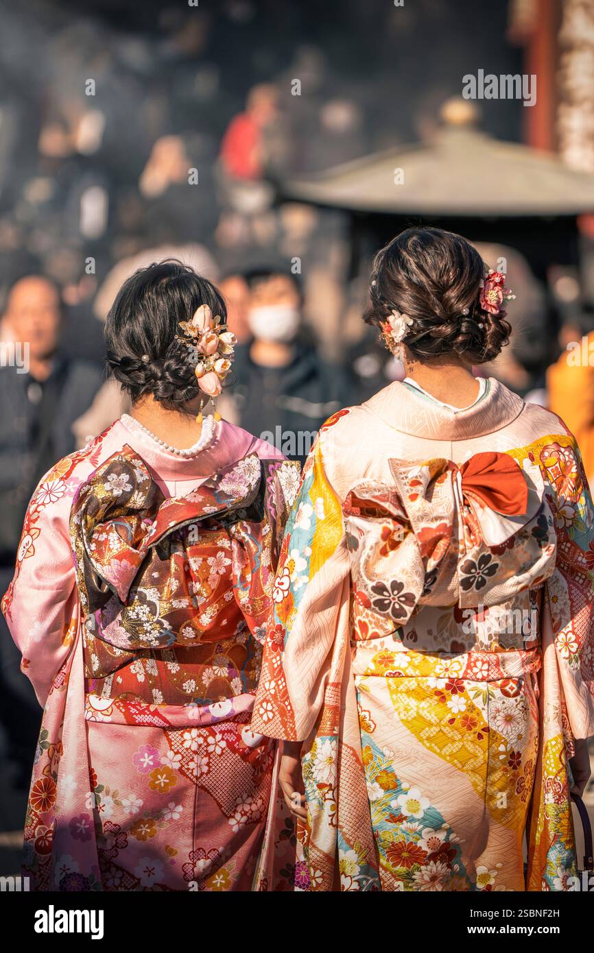 Japan, Honshu, Tokyo, Asakusa district, portrait of two women dressed ...