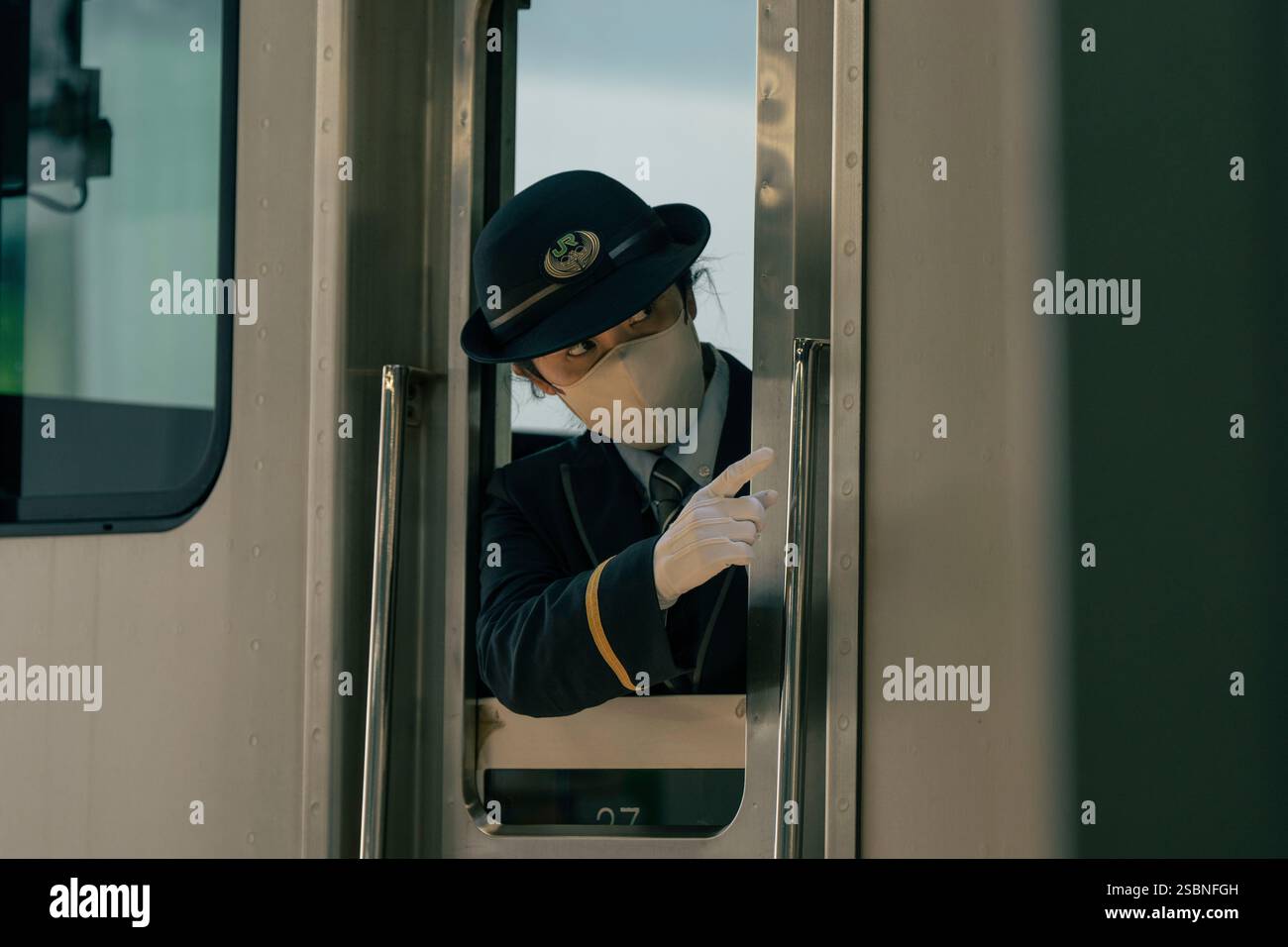 Japan, Honshu, Tokyo, portrait of a female subway driver on the ...