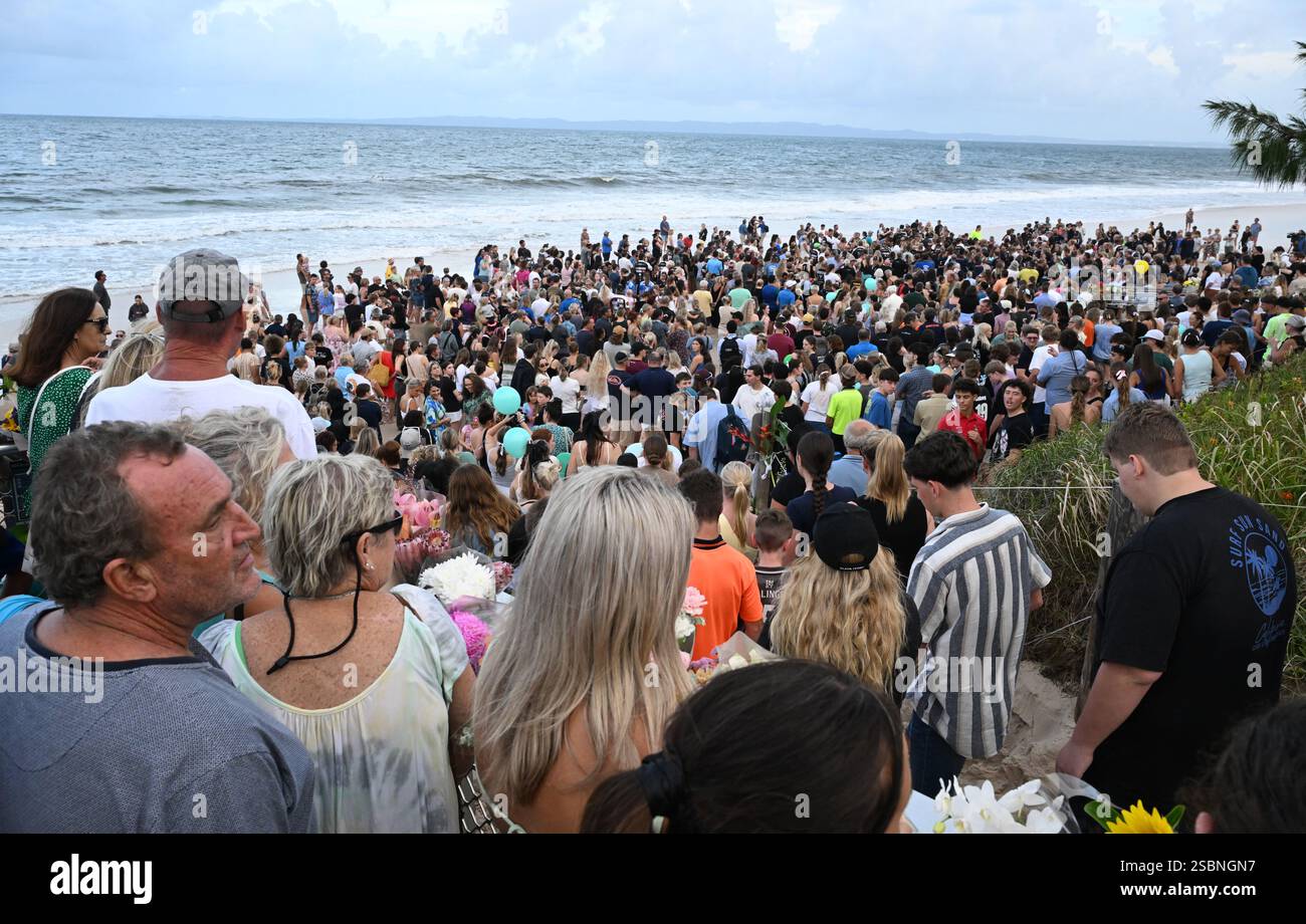 People are seen during a vigil for shark attack victim Charlize Zmuda ...