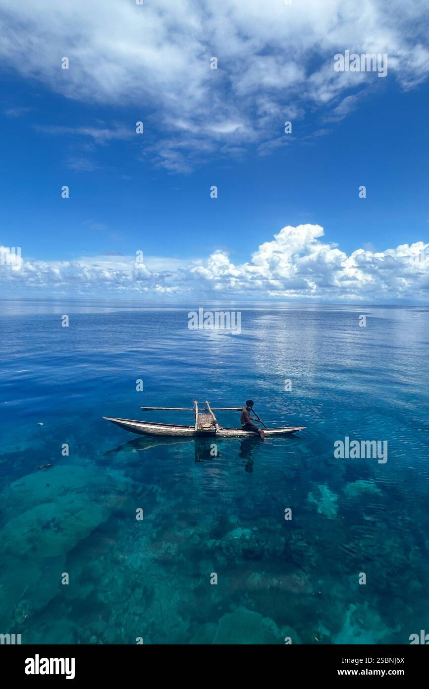 Residents of Vitu Islands in their traditional dugout canoes, Garove ...