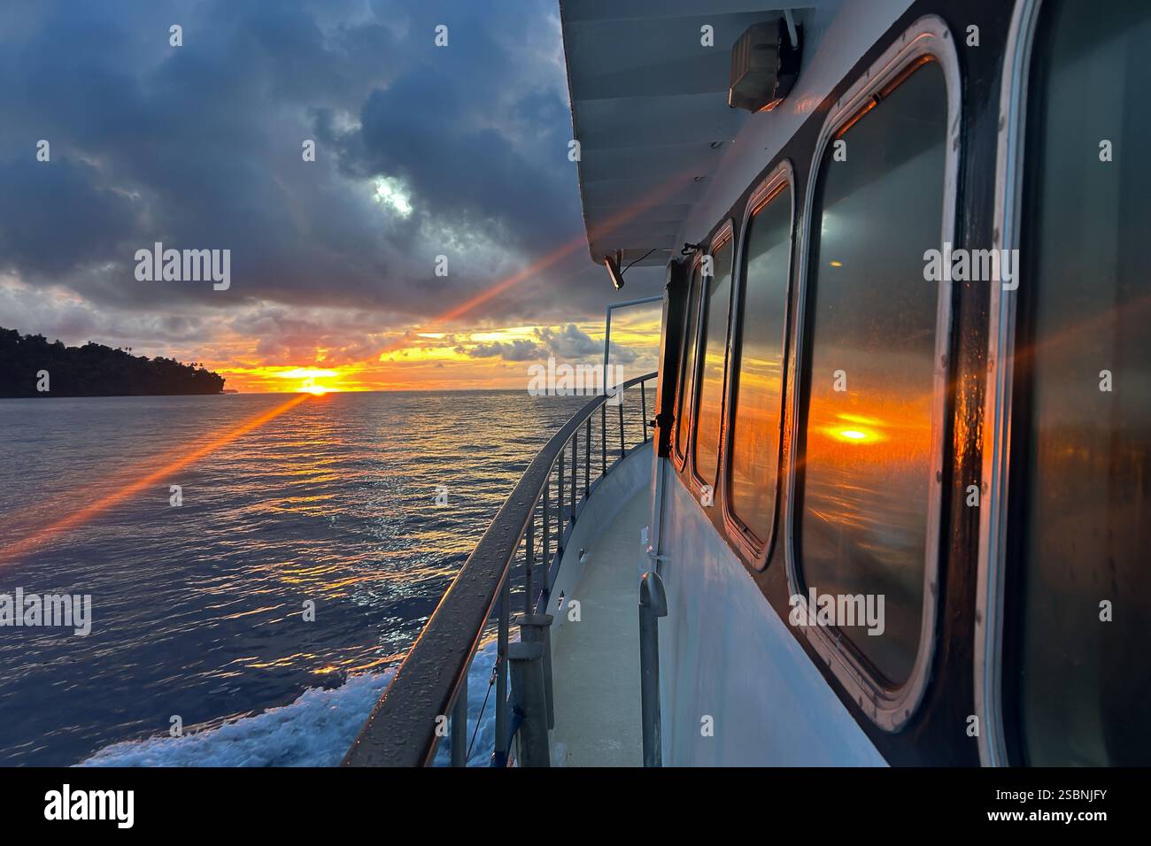 Sunset view from a boat, Vitu Islands in the Bismarck Sea off New ...