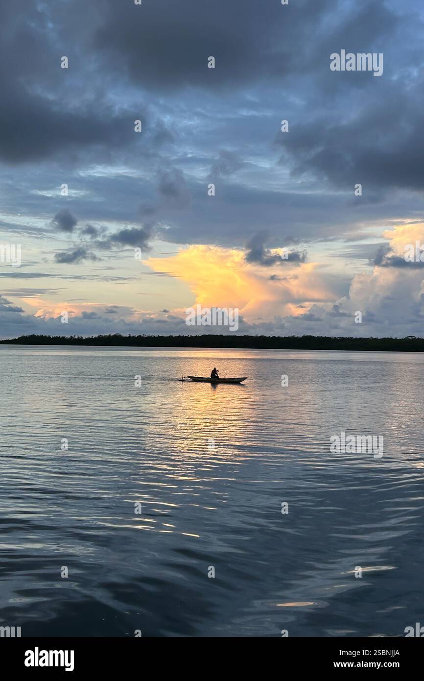 Local riding the traditional canoe in Bismarck sea, New Ireland ...