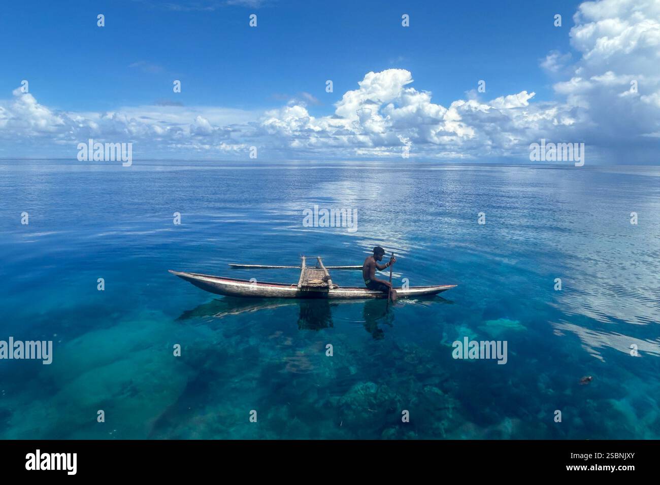 Residents of Vitu Islands in their traditional dugout canoes, Garove ...