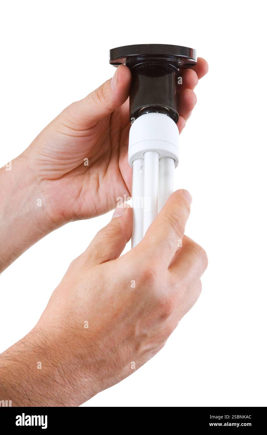 energy-saving lamp in hand isolated on white background Stock Photo - Alamy