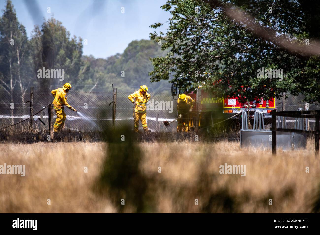 Country Fire Authority crews work quickly to contain a grass fire ...