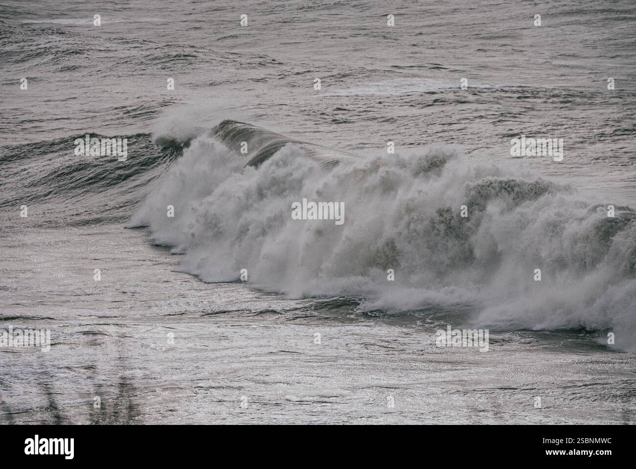 The ocean is rough and the waves are high. The water is choppy and the ...