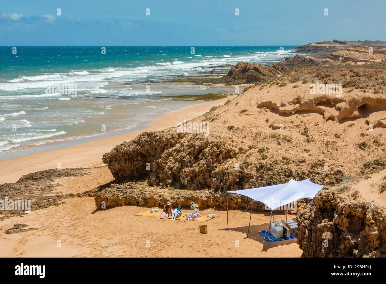 Morocco, Sidi Bennour province, Oualidia, women on a mat on the beach ...