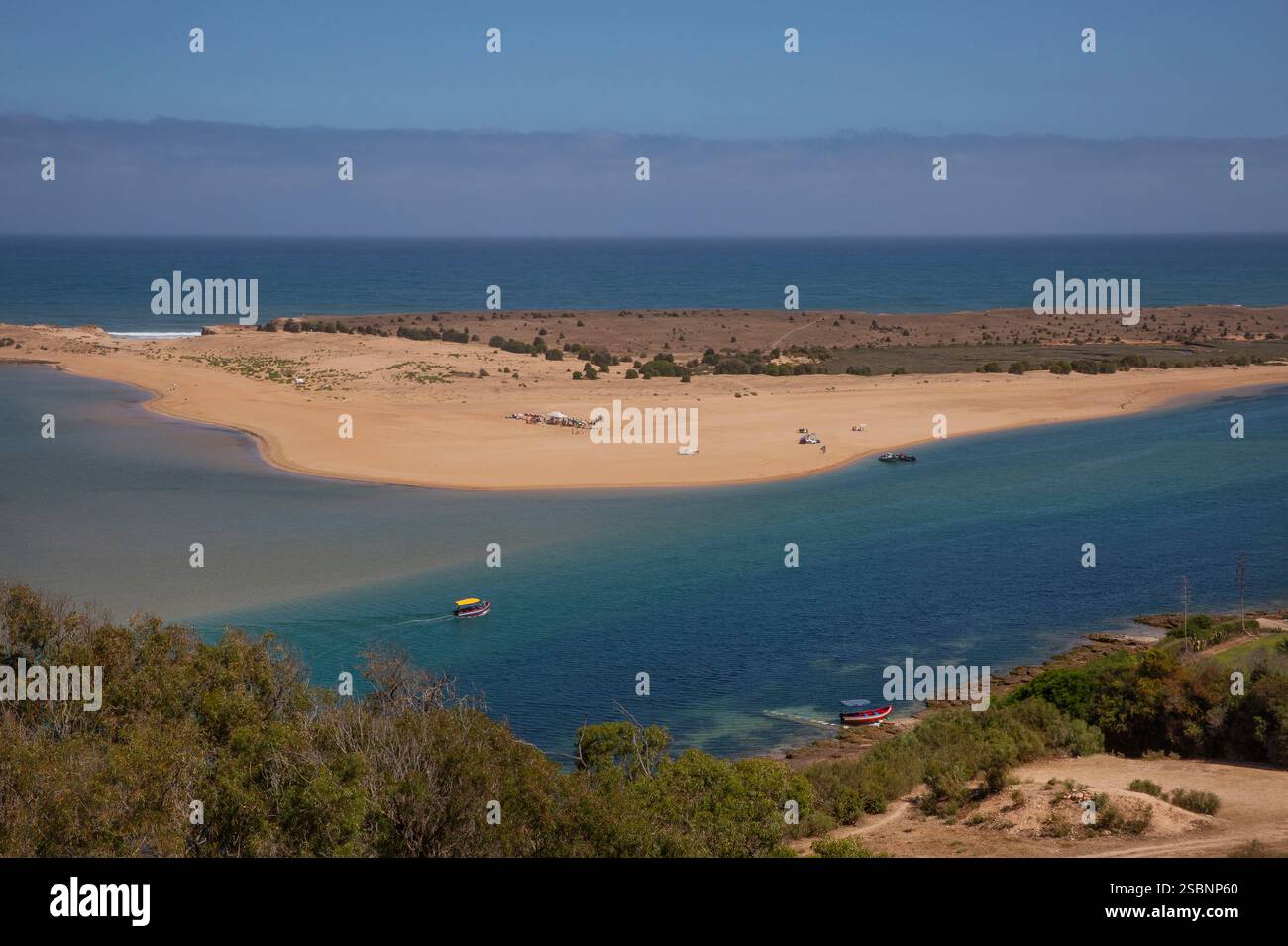 Morocco, Sidi Bennour province, Oualidia, colorful boat in the blue ...