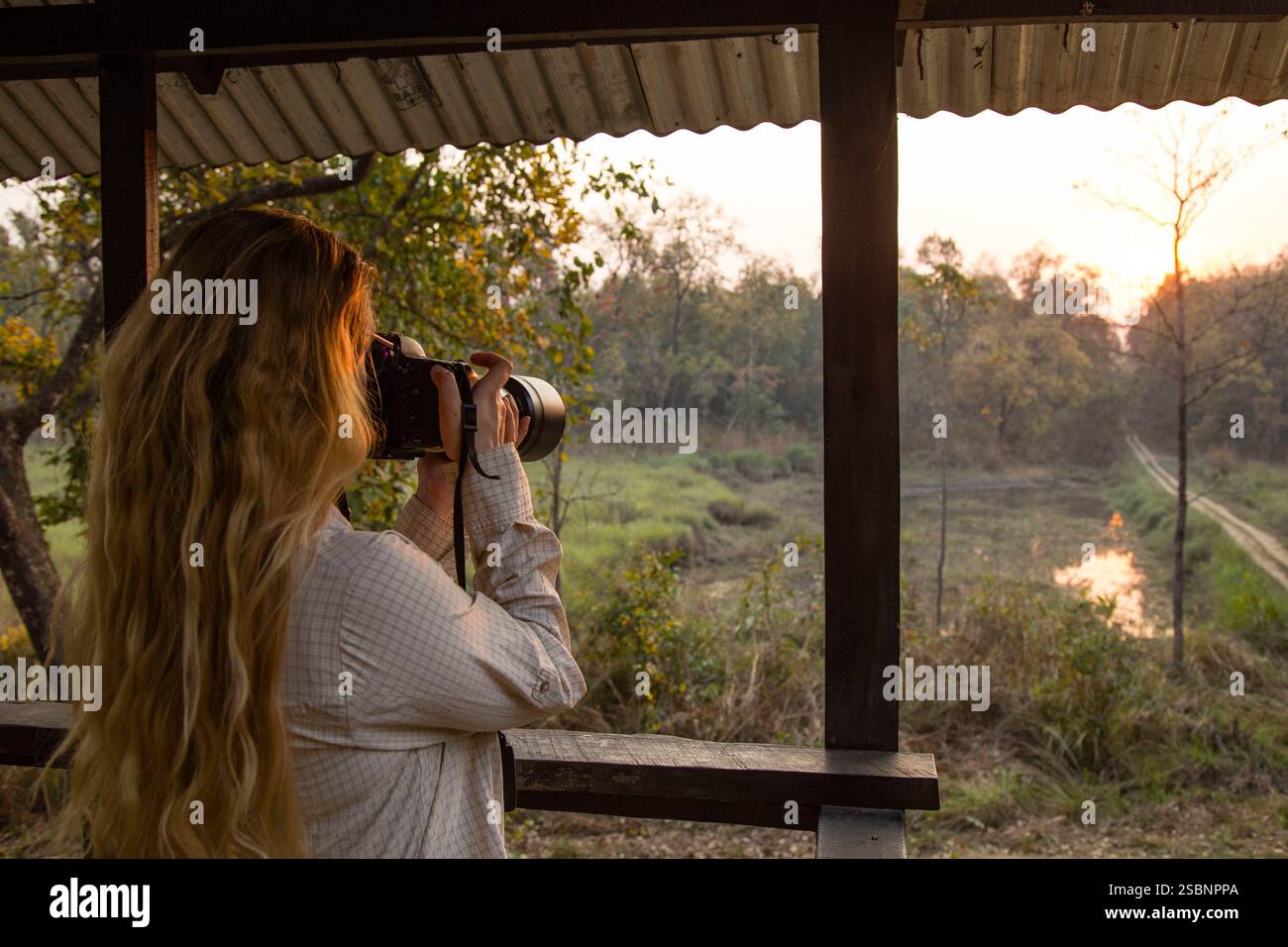 Nepal, Chitwan National Park, Sauraha, a tourist taking pictures from ...