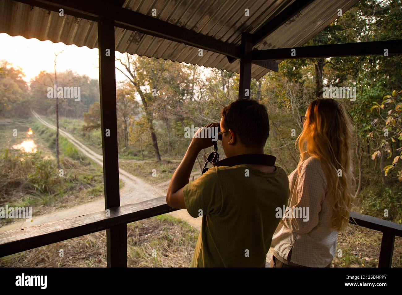 Nepal, Chitwan National Park, Sauraha, a tourist and a her guide ...