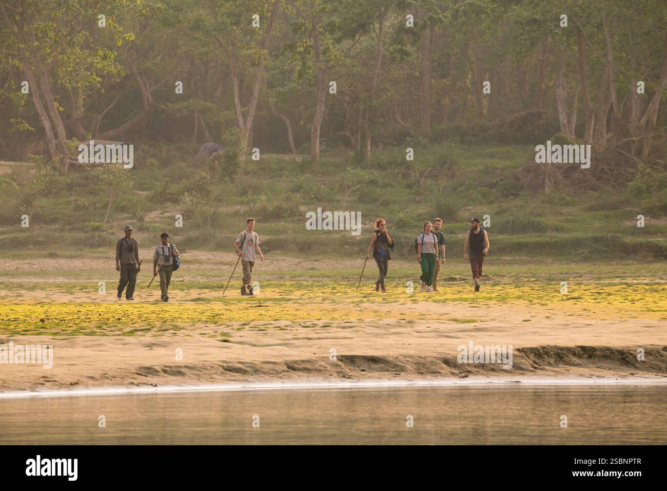 Nepal, Chitwan National Park, Sauraha, group of tourists walking back ...