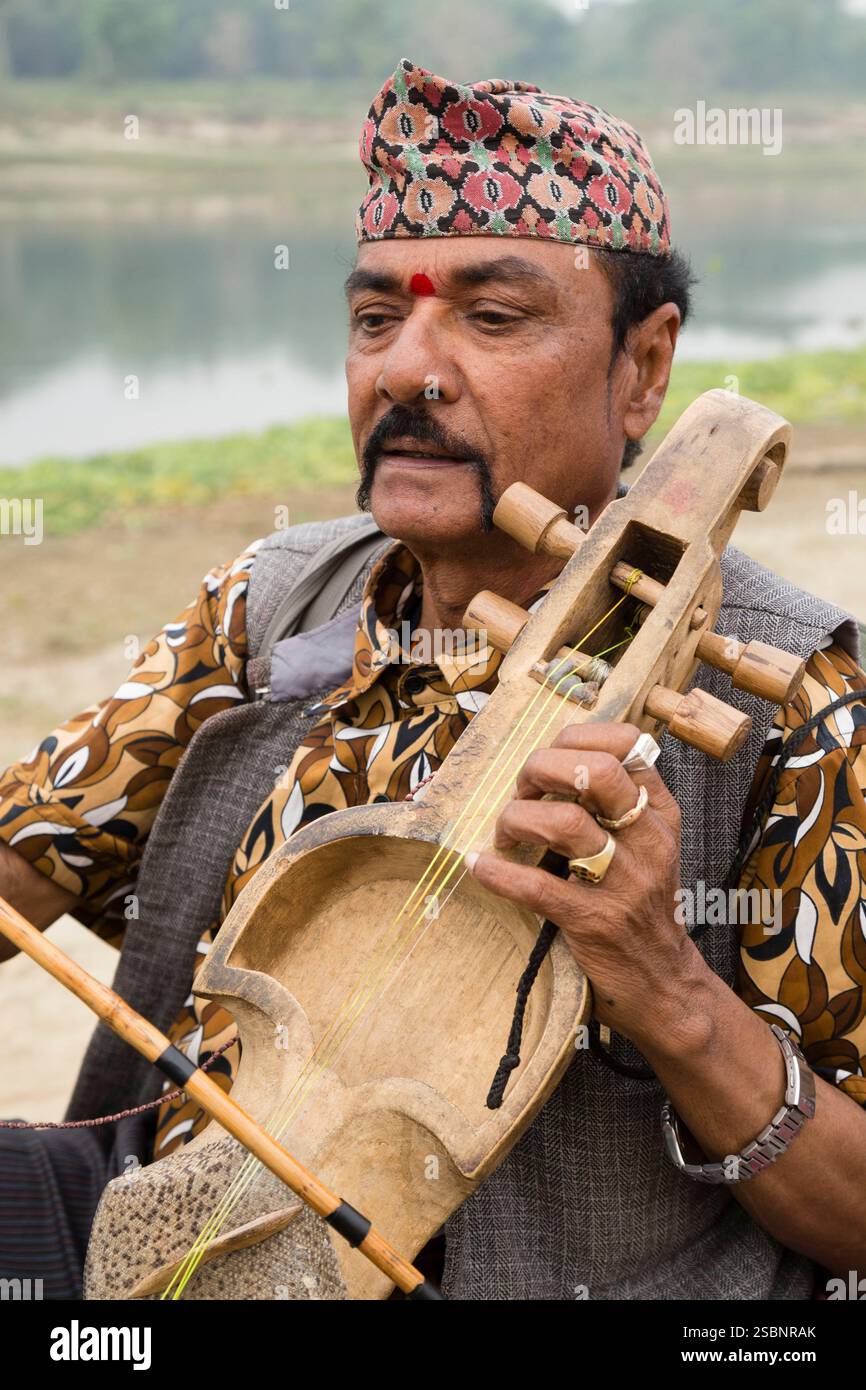 Nepal, Chitwan, Sauraha, man playing sarangi the nepali violin Stock ...