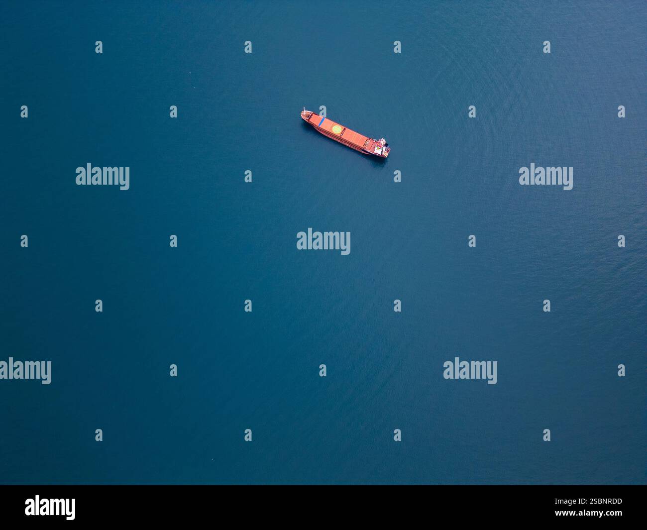 An aerial perspective of cargo ships floating on the open sea ...