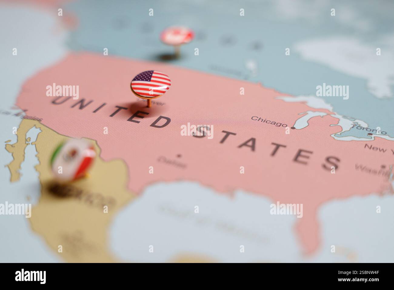 US flag push pin marking the United States on a map, with Mexico and ...