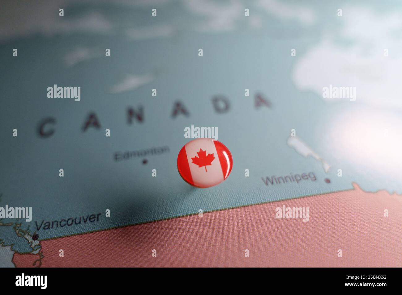 Canadian flag push pin marking Canada on a map. High quality photo ...
