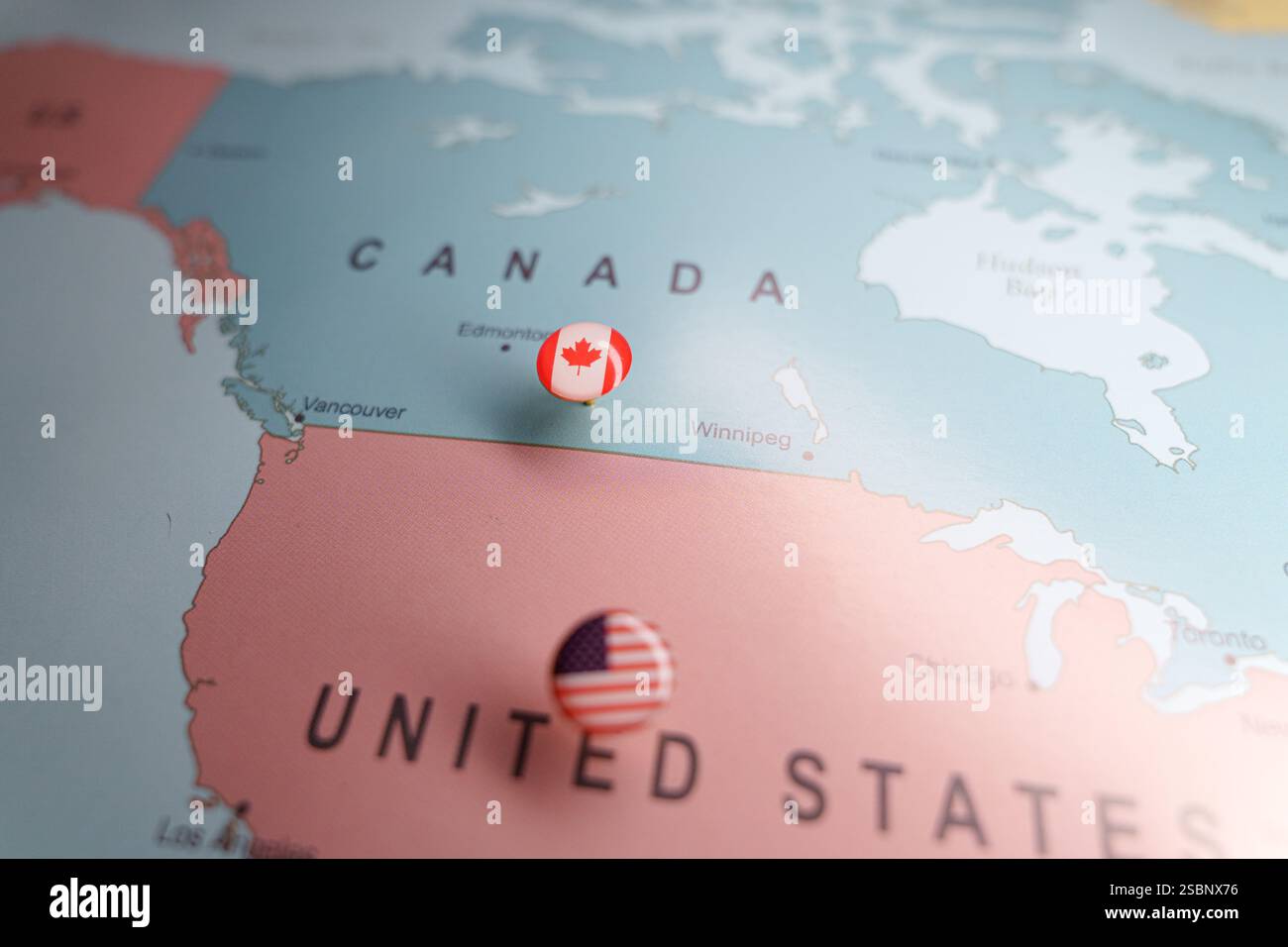 Canadian flag push pin marking Canada on a map. High quality photo ...