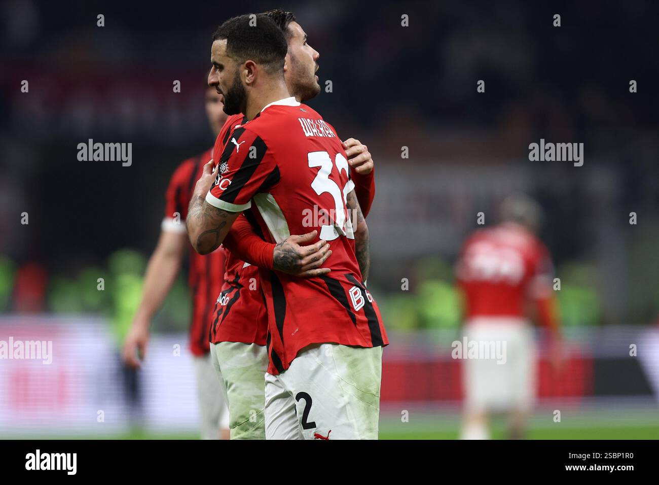 Kyle Walker of Ac Milan (F) embraces Theo Hernandez of Ac Milan (R ...