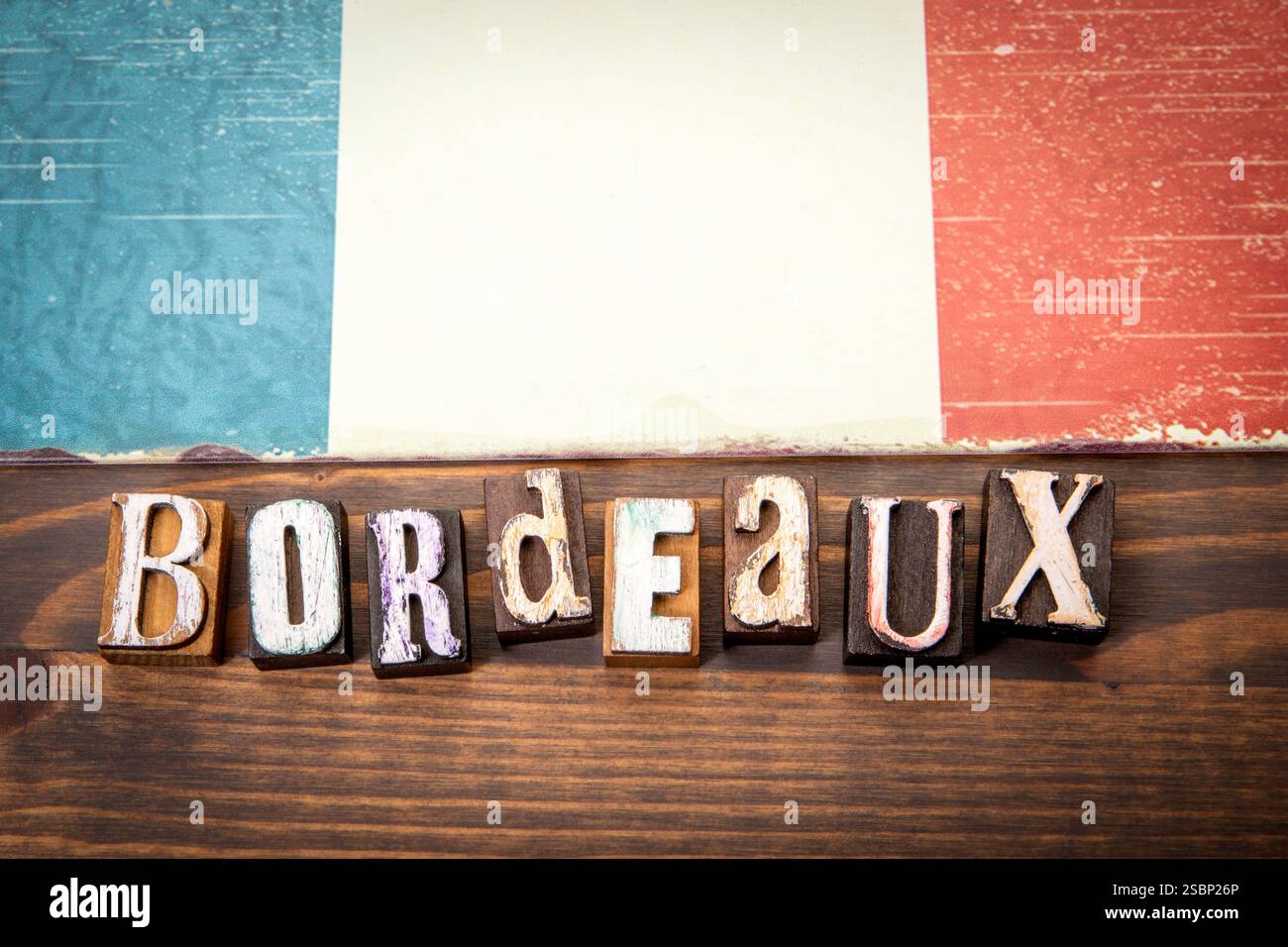 BORDEAUX. Flag and alphabet letters on wooden texture background Stock ...