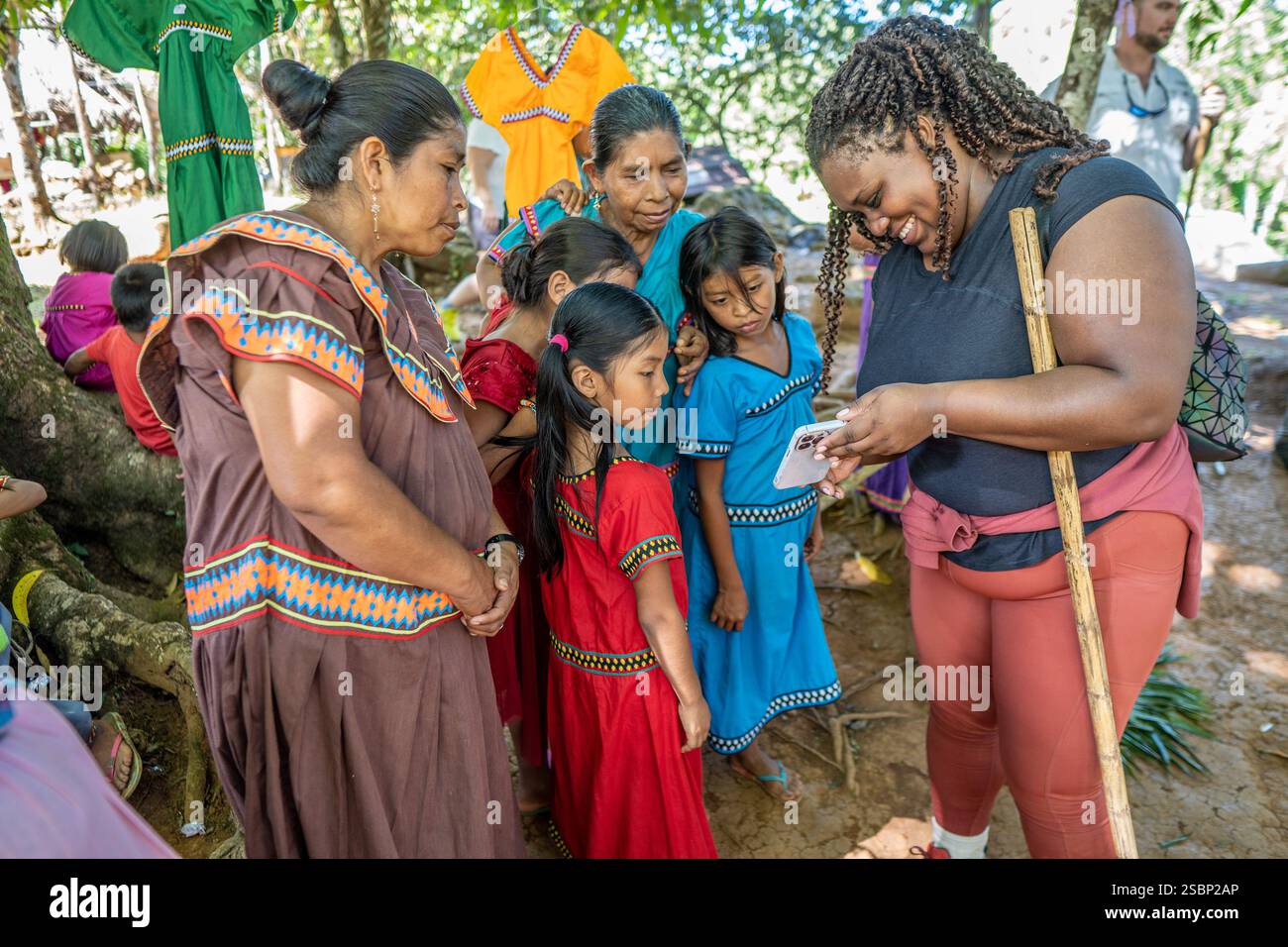 Tourist interacting with locals in Guaymi Mountain Village (Ngäbe-Buglé ...