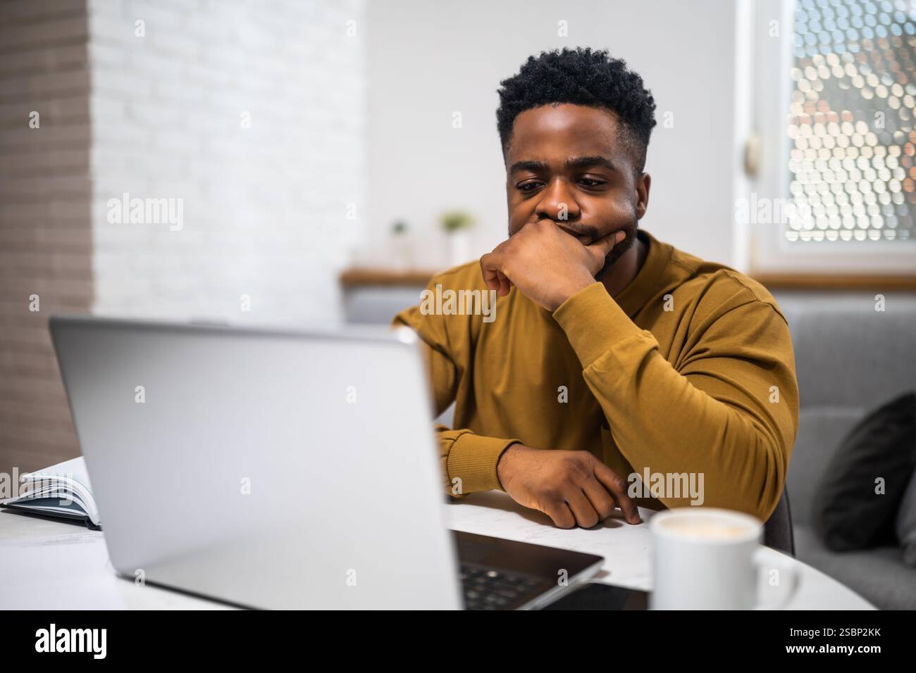 Worried african freelancer using hi-res stock photography and images ...