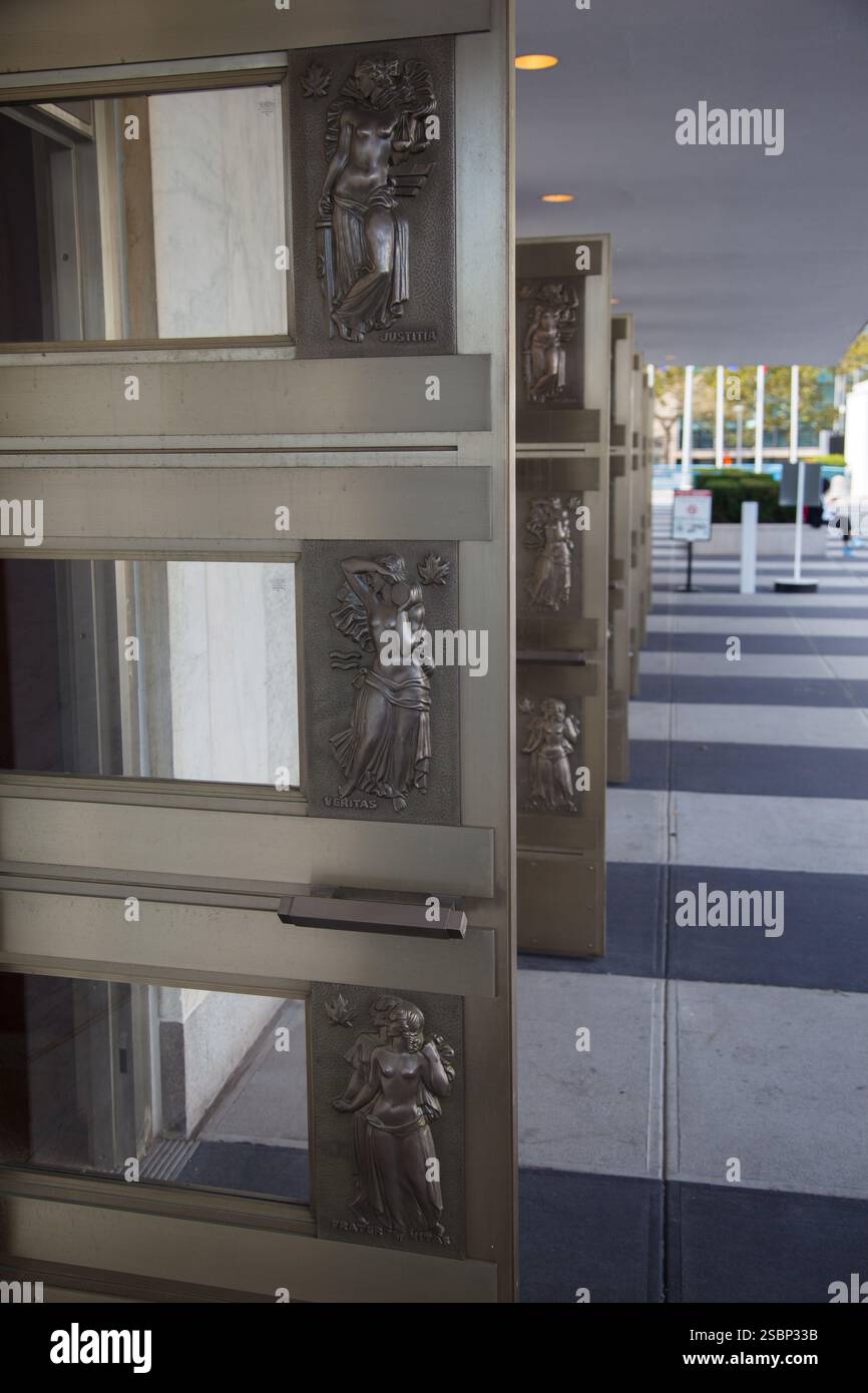 The Entrance doors with female bas reliefs in the headquarters of the ...
