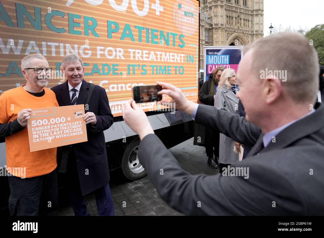 Former Liberal Democrats leader Tim Farron (right) takes a photo of ...