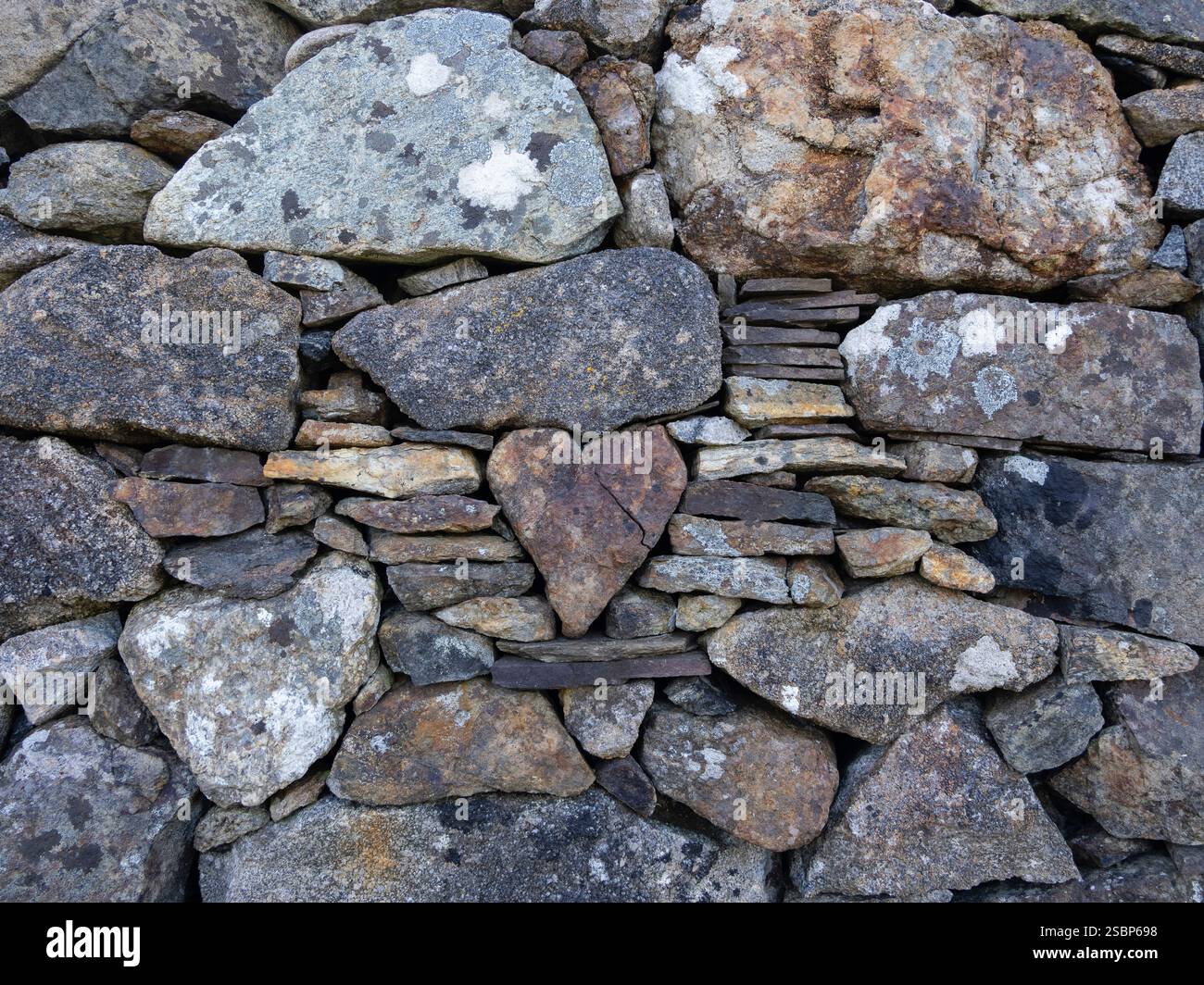 The broken heart in the stone wall outside St Clement's Church, Rodel ...