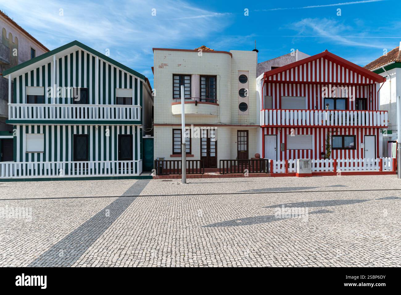 Colorful houses with striped facades in a charming coastal village ...