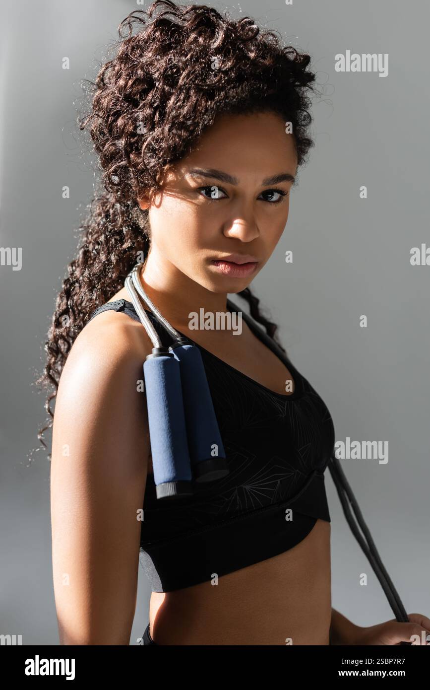 Strong female athlete poses with determination, embodying power and ...