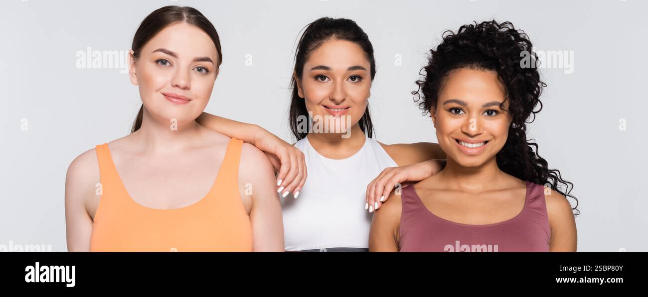 Three strong and fit women pose together, radiating energy and beauty ...
