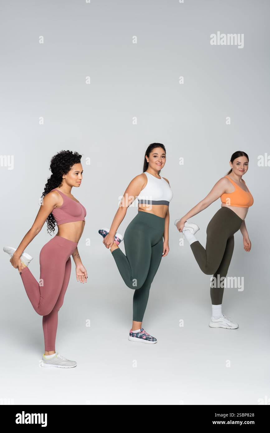 Three strong women show their fitness dedication with synchronized ...