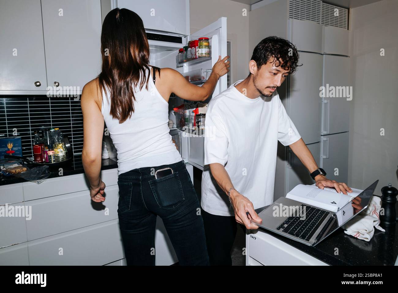 Two women opening laptop in hi-res stock photography and images - Alamy