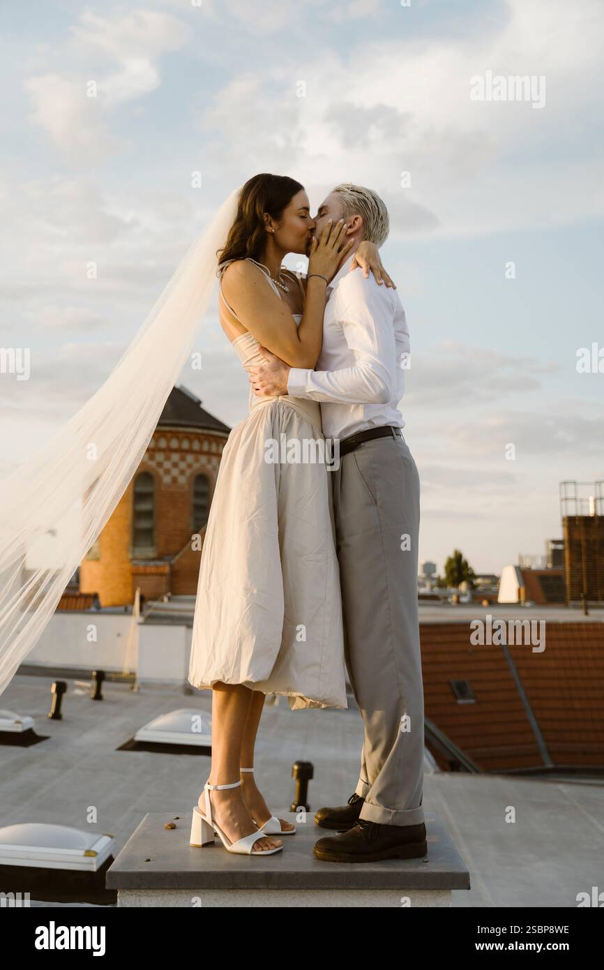 Romantic Newly Married Couple Kissing Each Other While Standing On