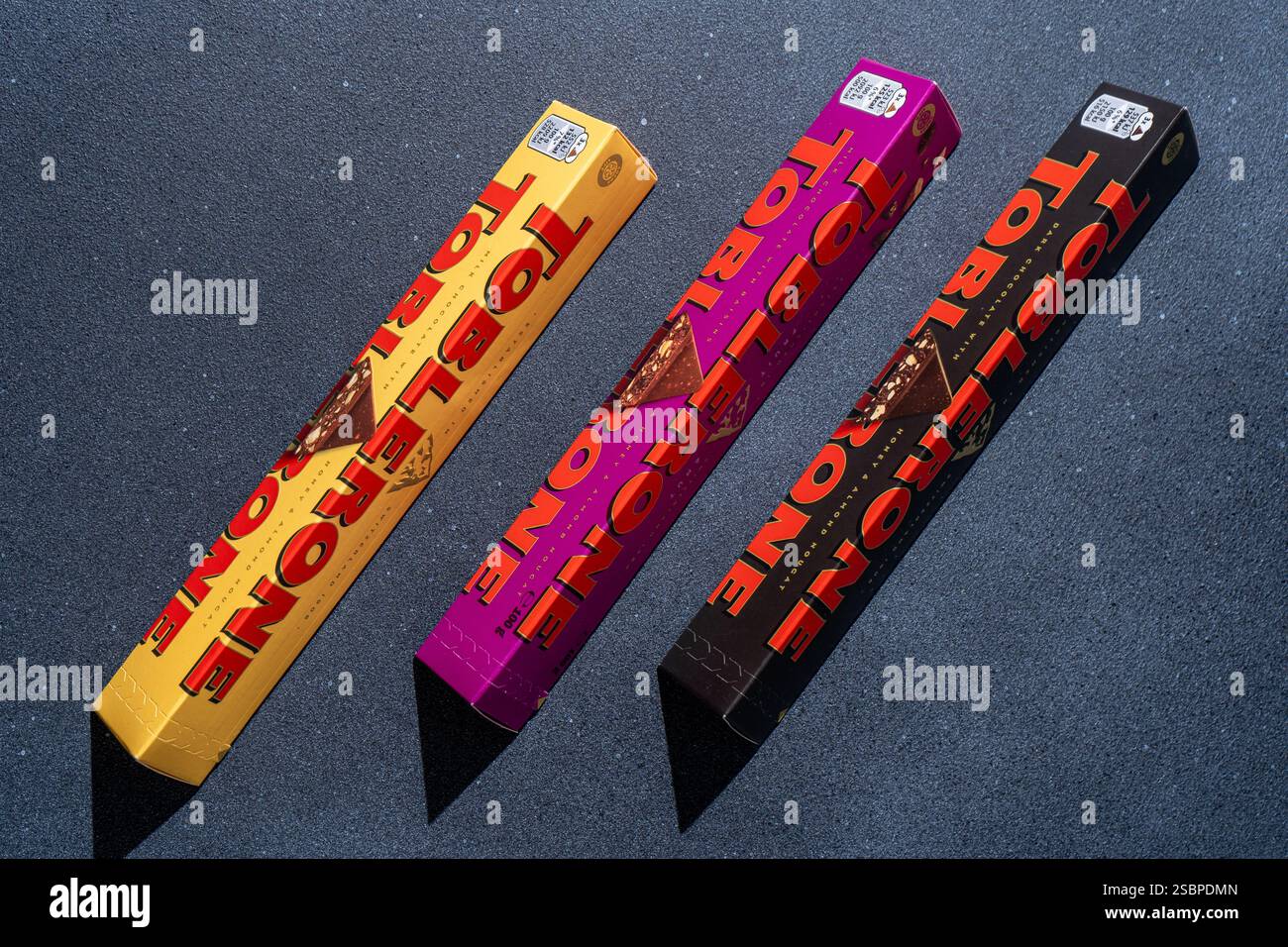 Toblerone brand chocolate packaging. Swiss Mondelez candy bar black ...