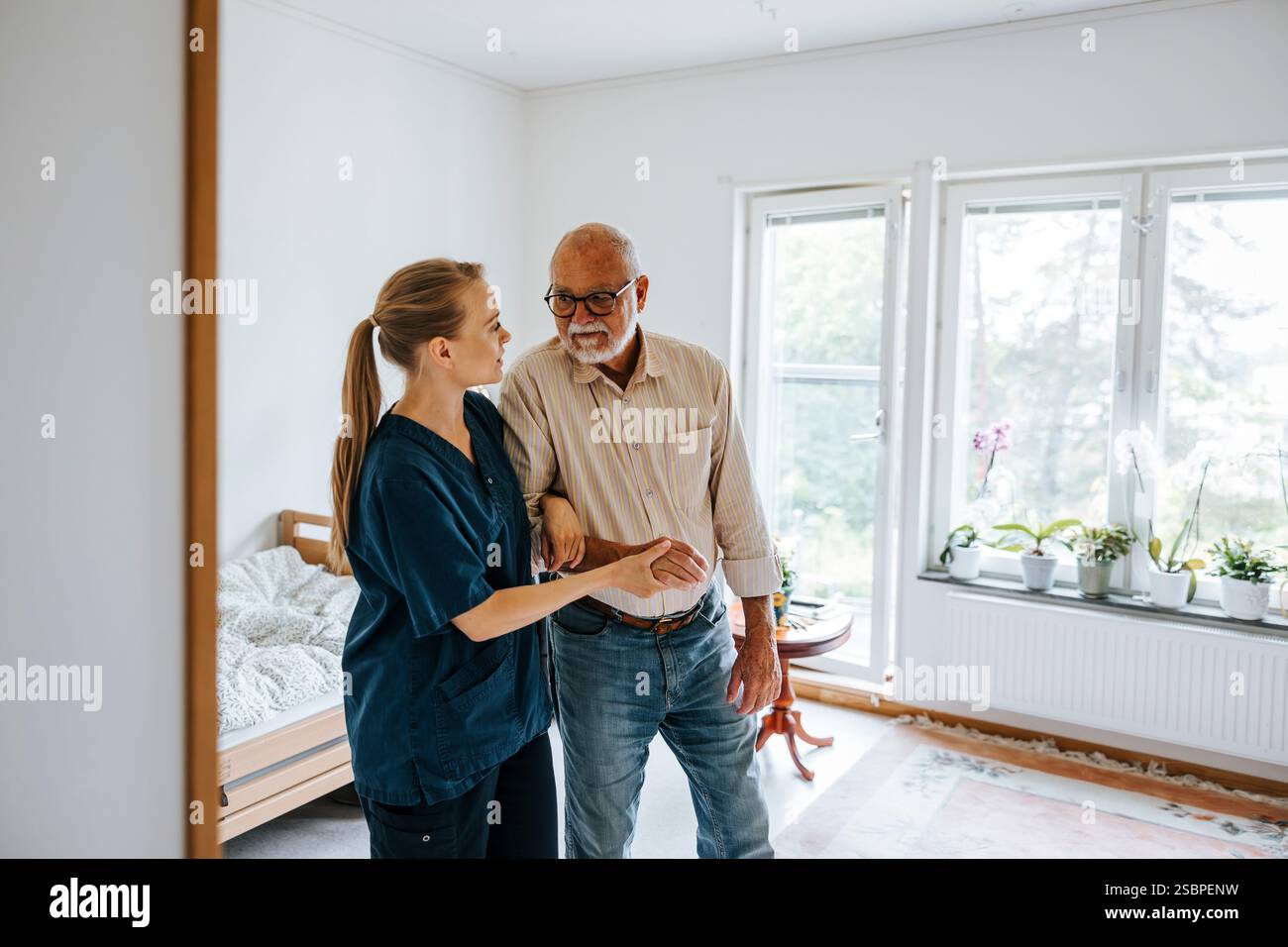 Female doctor supporting patient arm hi-res stock photography and images - Alamy