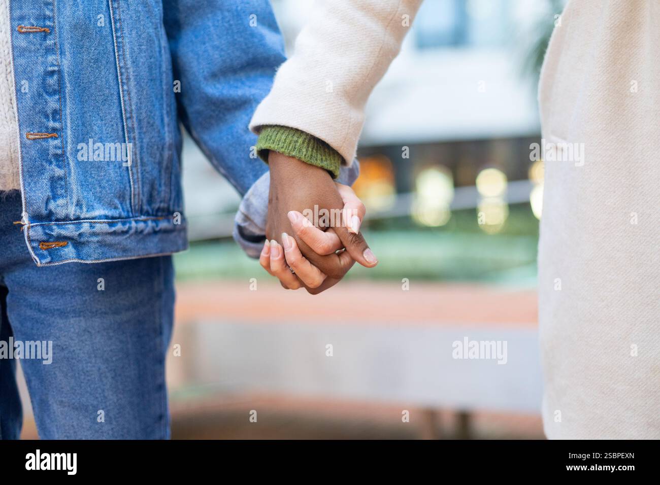 Two women holding hands, symbolizing their strong bond, trust, and ...