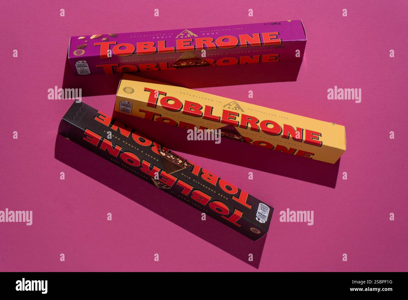 Toblerone brand chocolate packaging. Swiss Mondelez set candy bar pink ...