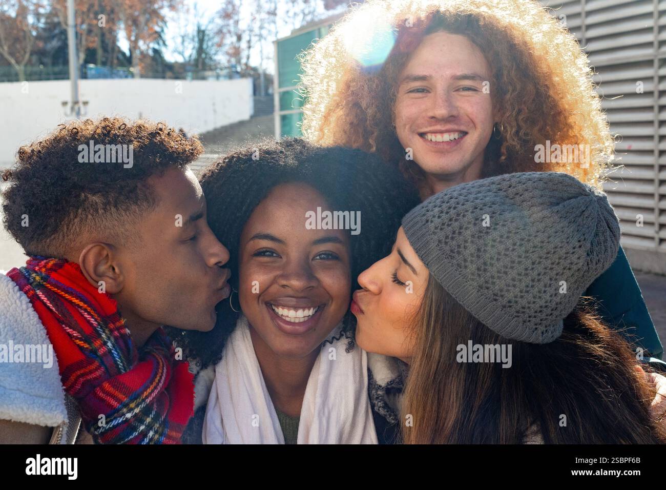 Two friends kissing a girl on the cheek, expressing their love and ...