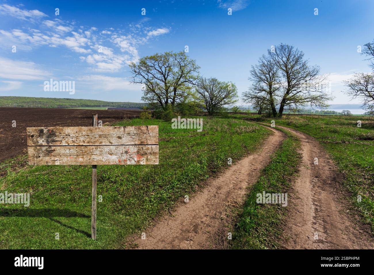 old wooden sign on a country road in rural areas Stock Photo - Alamy