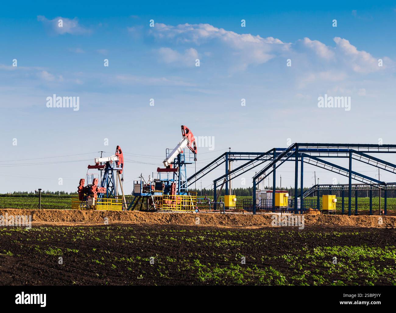 Oil and gas industry. Work of oil pump jack on a oil field Stock Photo ...