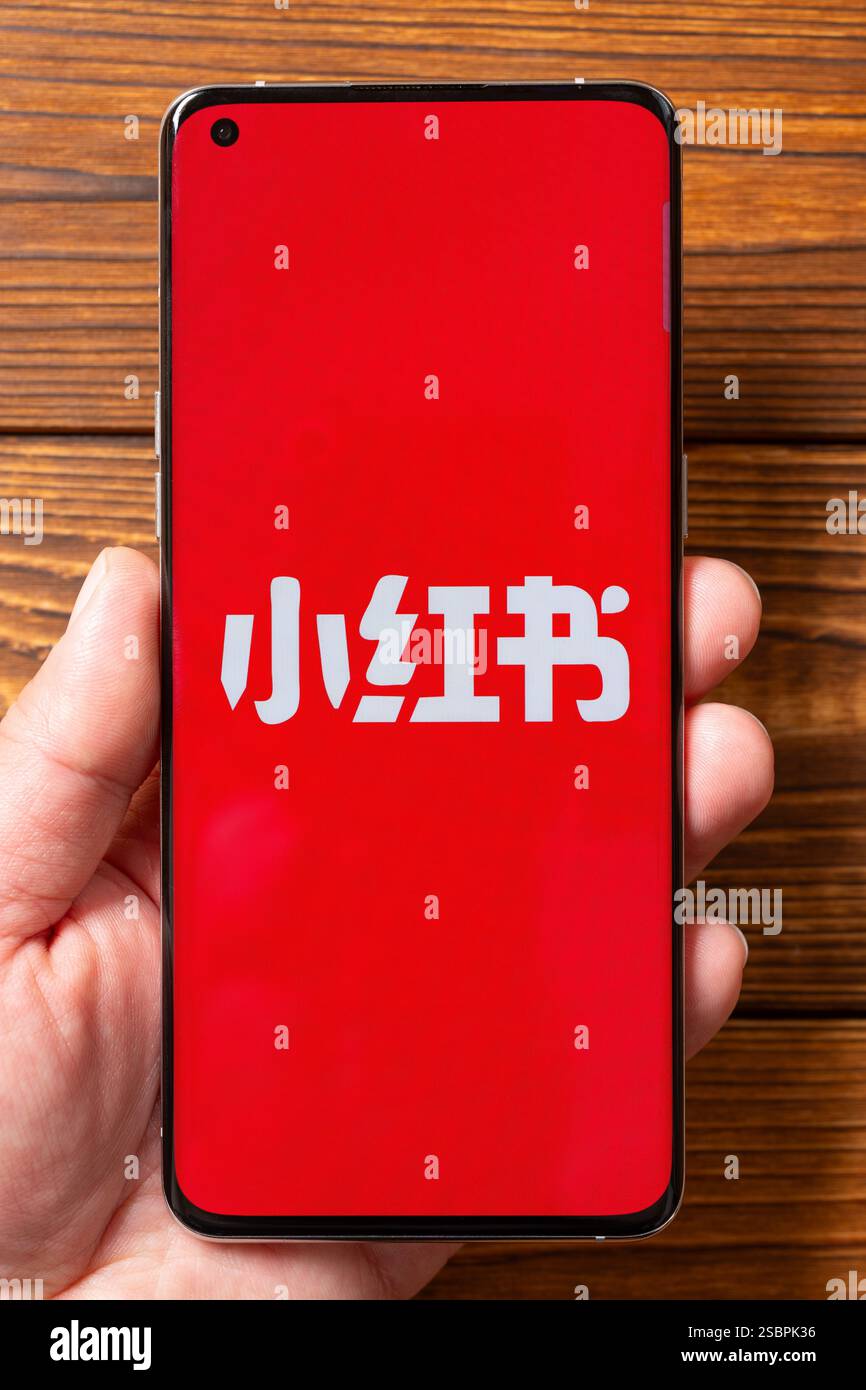 ZHONGSHAN China-January 28,2025:man holding a mobile with Rednote logo ...