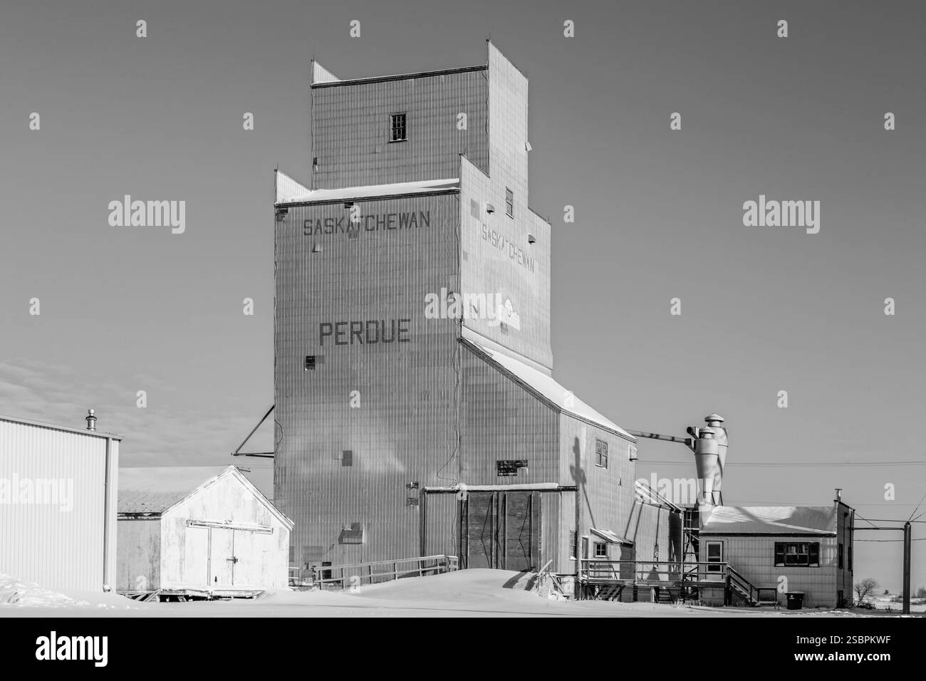 Large grain silo with the word Peruel on it. The silo is surrounded by ...
