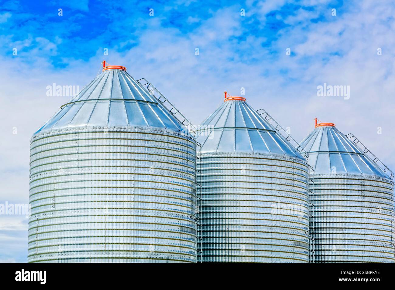 Three silos are stacked on top of each other. The top two silos are ...