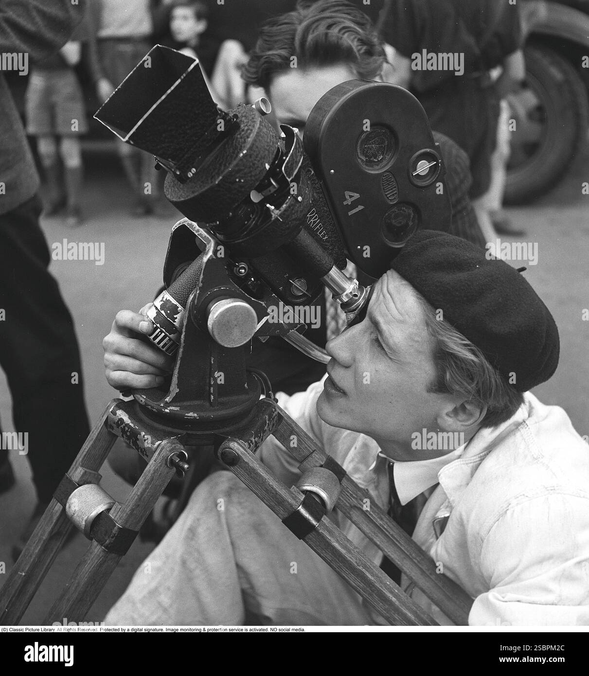 Filming in the 1940s. Cinematographer Curt Jonsson looking in the ...