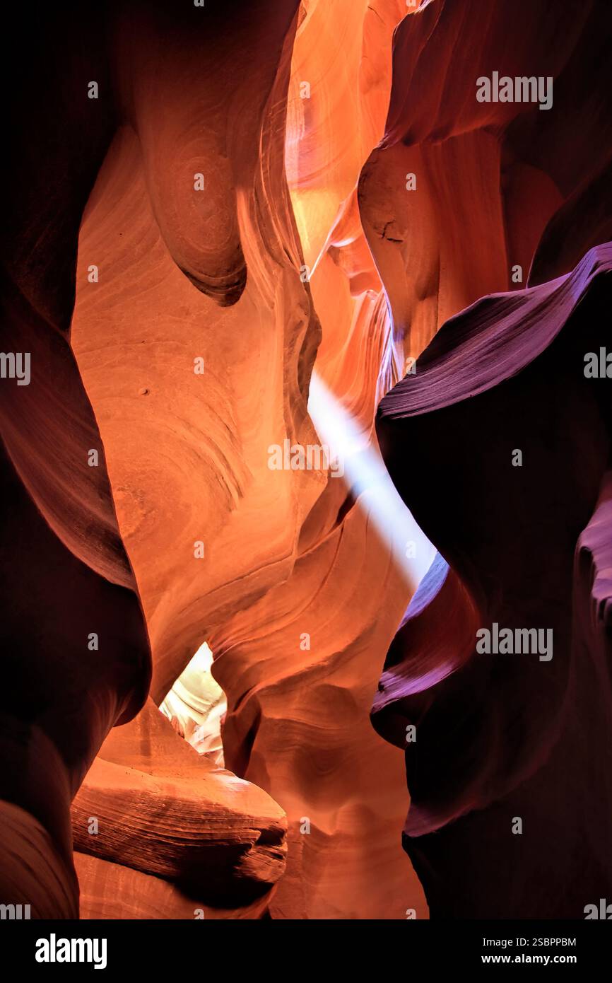 A cave with a light shining through it. The light is on the left side ...
