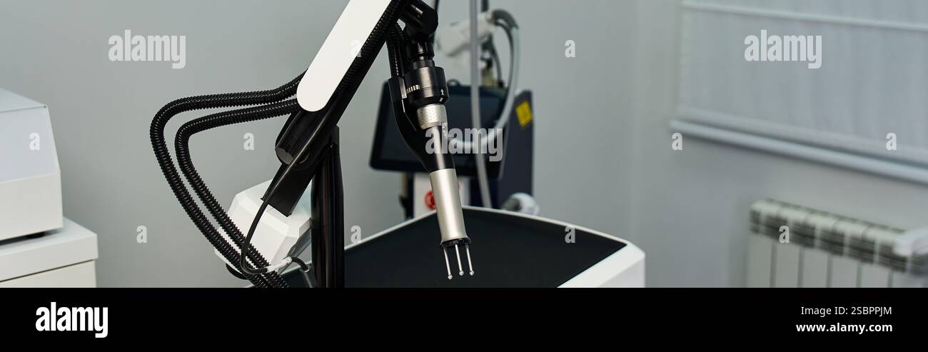 A modern dermatology device is set up in a well lit clinic for skin ...