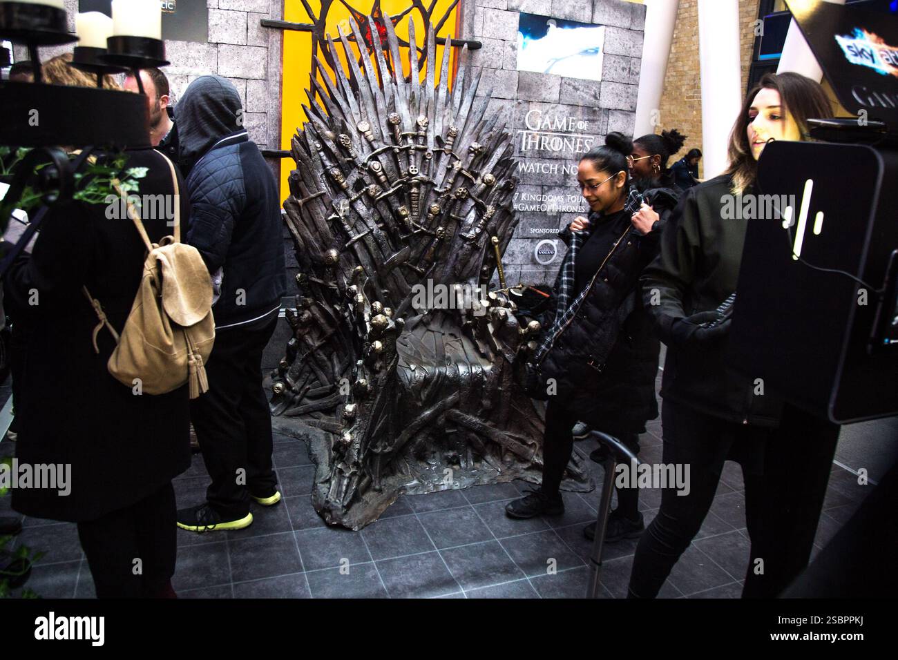 Fans sit on the Iron Throne to pose for Sky Atlantic's Release of the ...