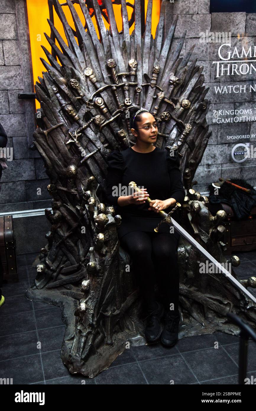 Fans sit on the Iron Throne to pose for Sky Atlantic's Release of the ...