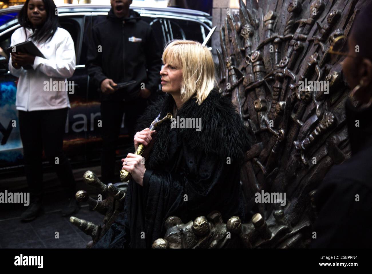 Fans sit on the Iron Throne to pose for Sky Atlantic's Release of the ...